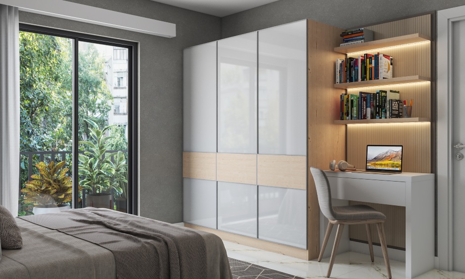 A Three-Door Wardrobe Design With An Attached Study Unit - DesignCafe